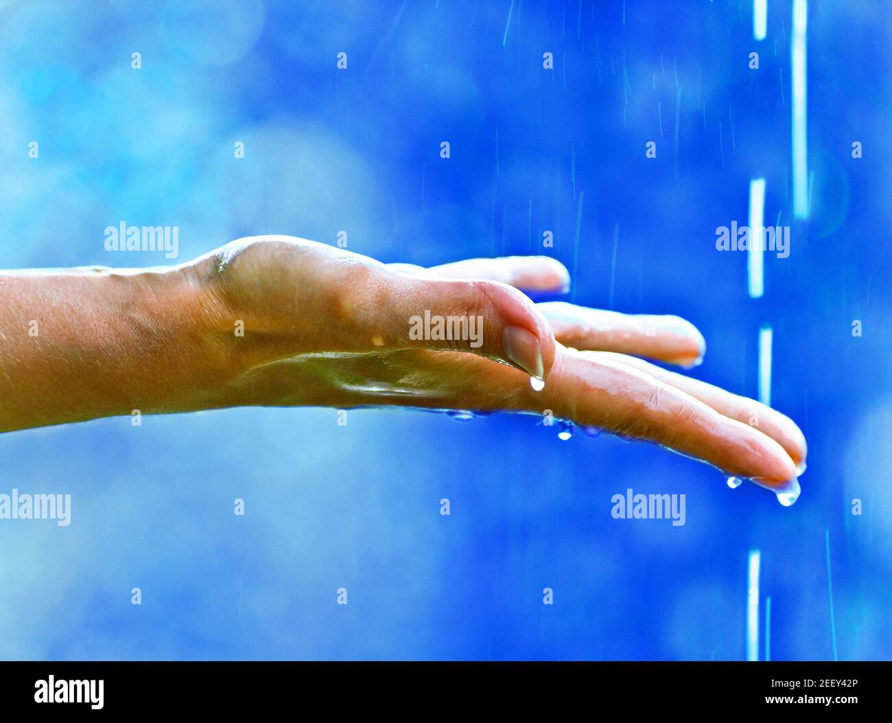 female hand under dripping Stock Photo - Alamy
