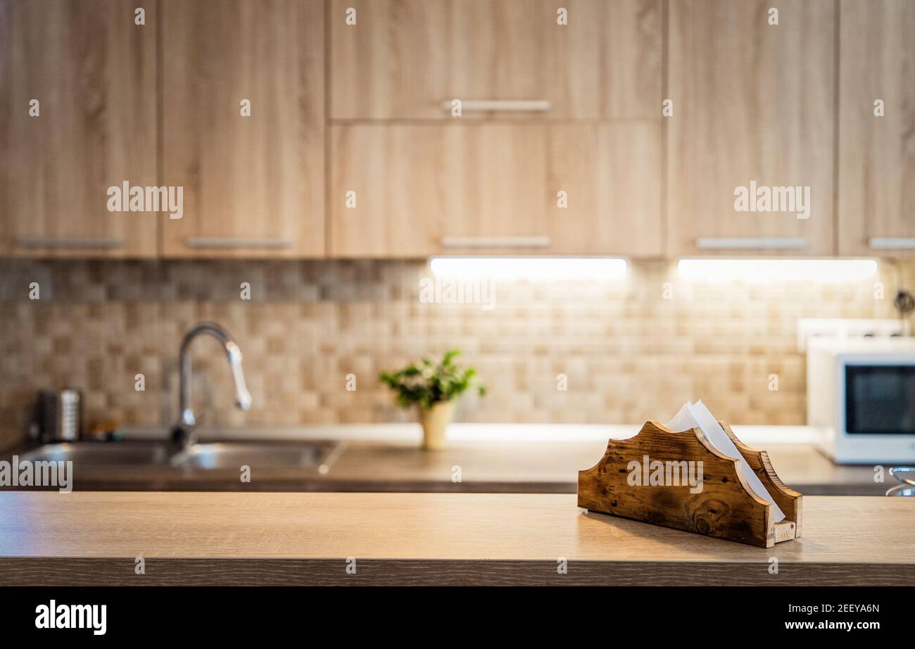 blurred kitchen interior and wooden desk space home background Stock ...