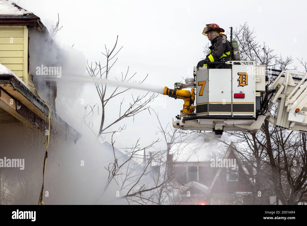Firefighters in Tower Ladder 7 fighting fire, Detroit, Michigan, USA ...