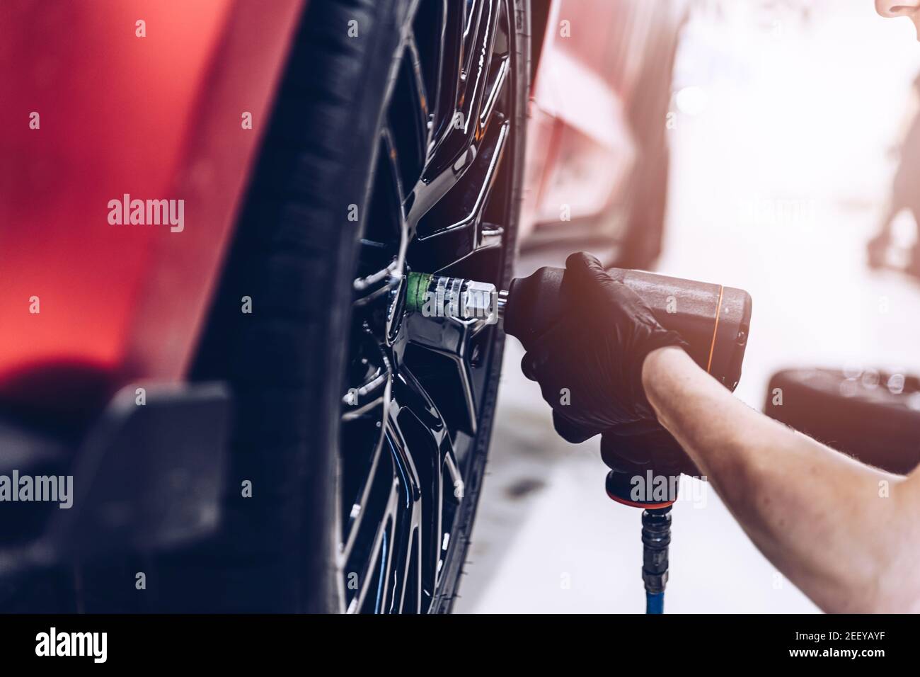 Changing car tire and wheel in the car mechanical service Stock Photo ...