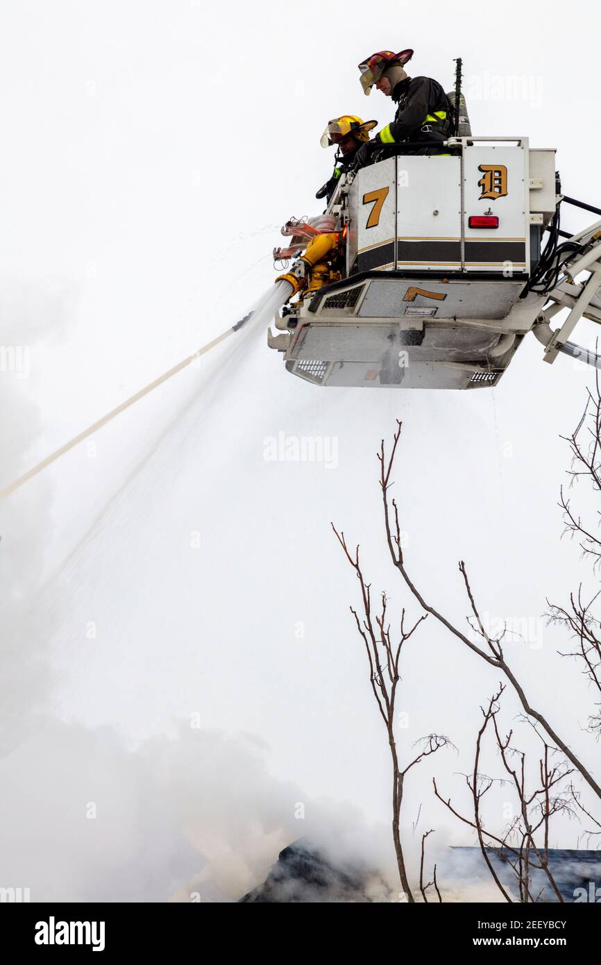 Firefighters in Tower Ladder 7 fighting fire, Detroit, Michigan, USA ...