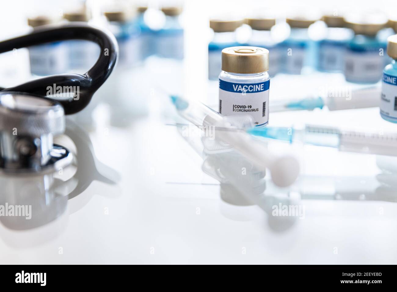 Coronavirus vaccine vials, ampoules and syringe on lab bench Stock ...