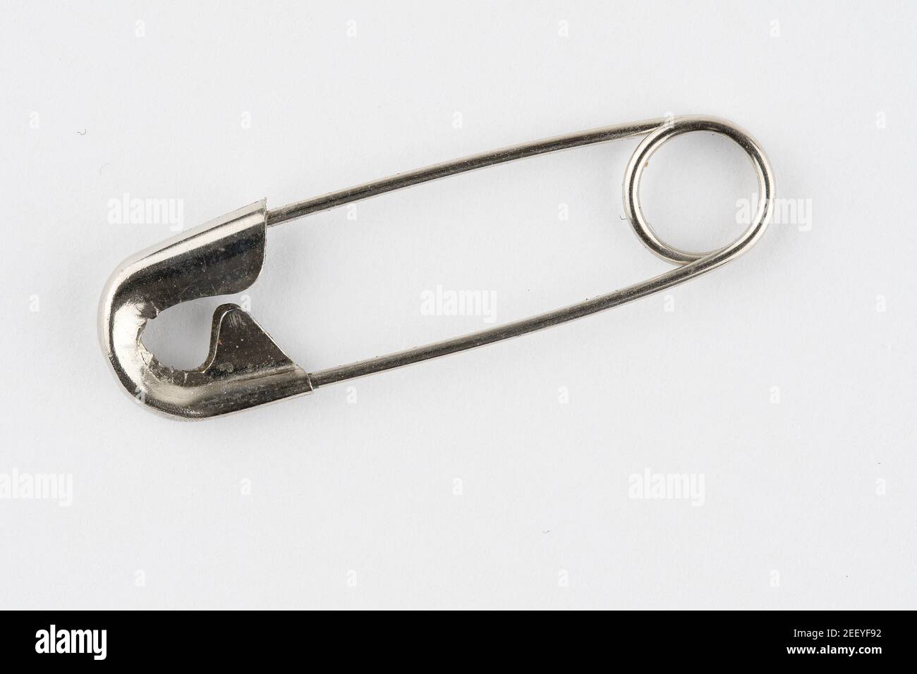 Macro image of a single closed safety pin Stock Photo - Alamy