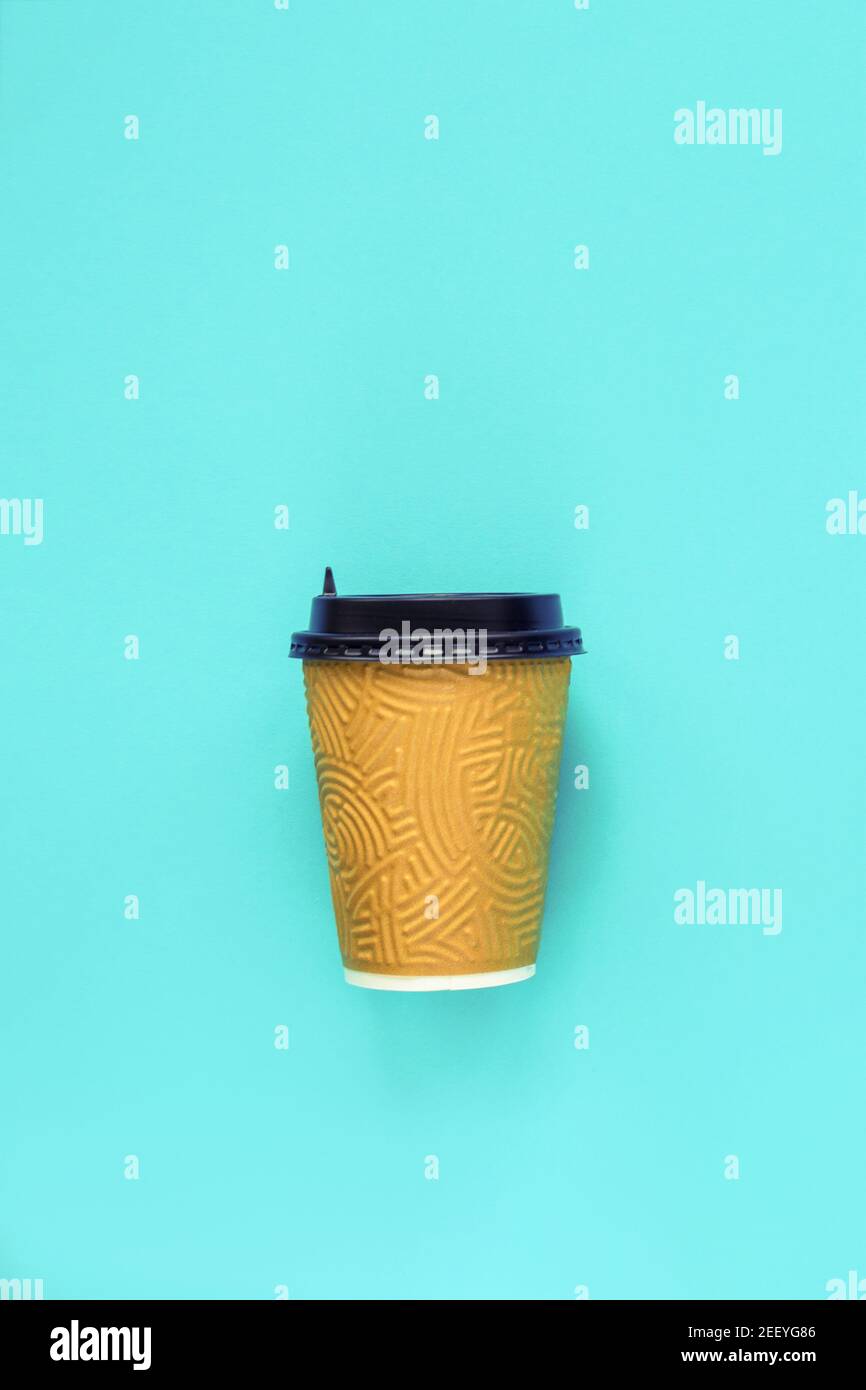 Disposable coffee container on blue background. Zero waste, green and ...