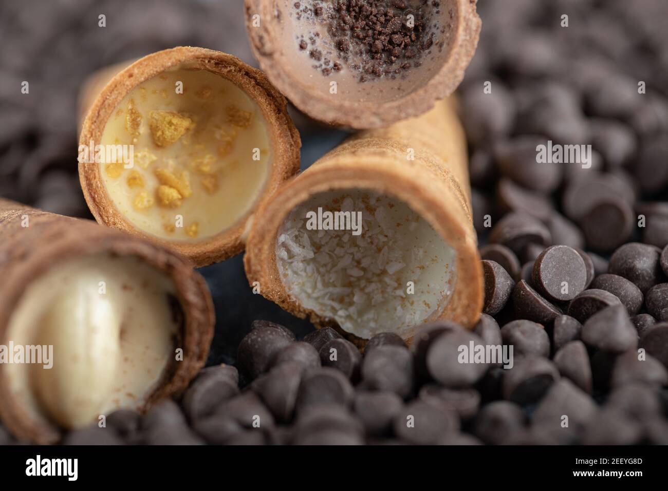 Sweet Conus candy with chocolate. Brown background Stock Photo - Alamy