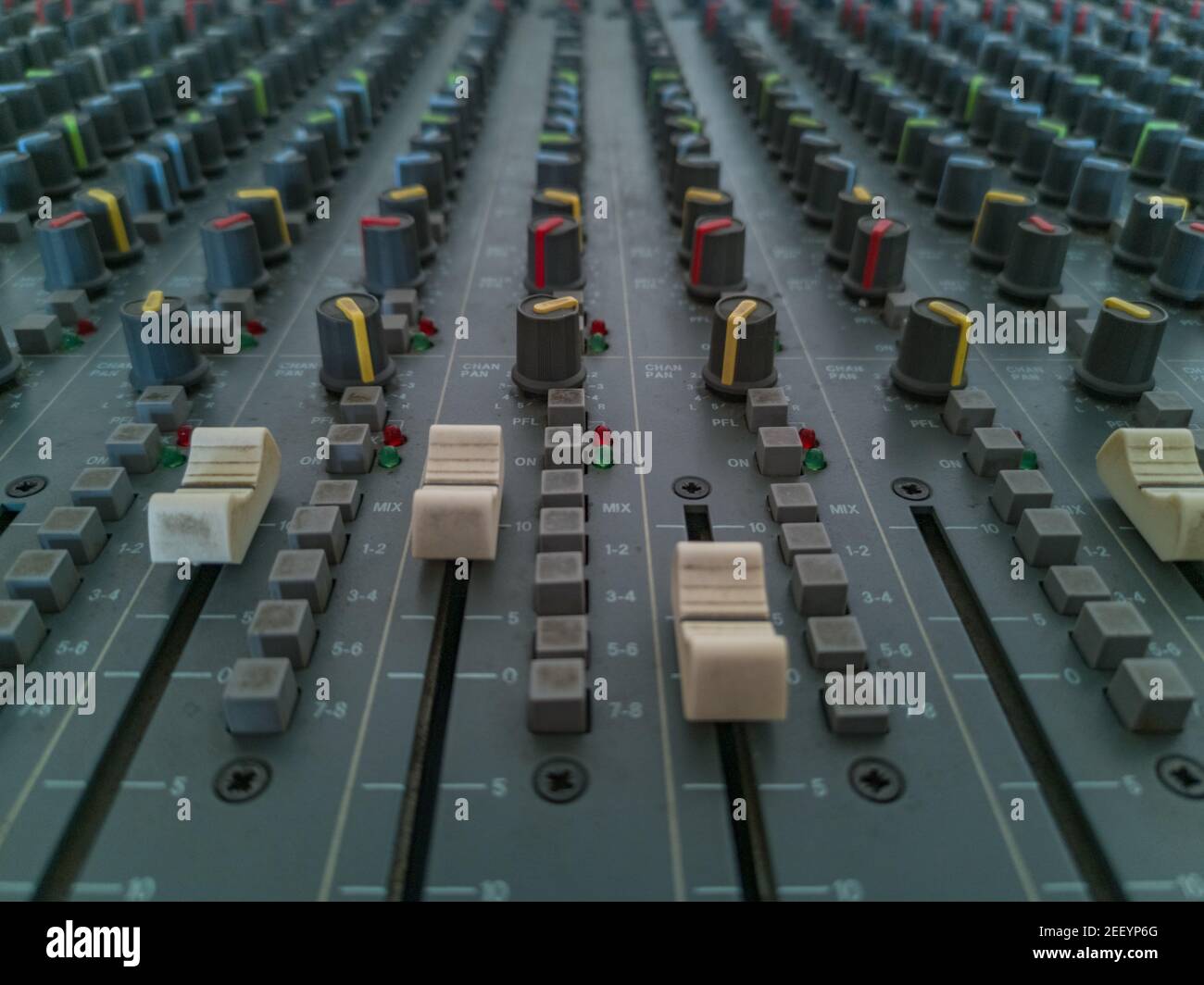 Front panel of old music radio console with colorful potentiometers and ...