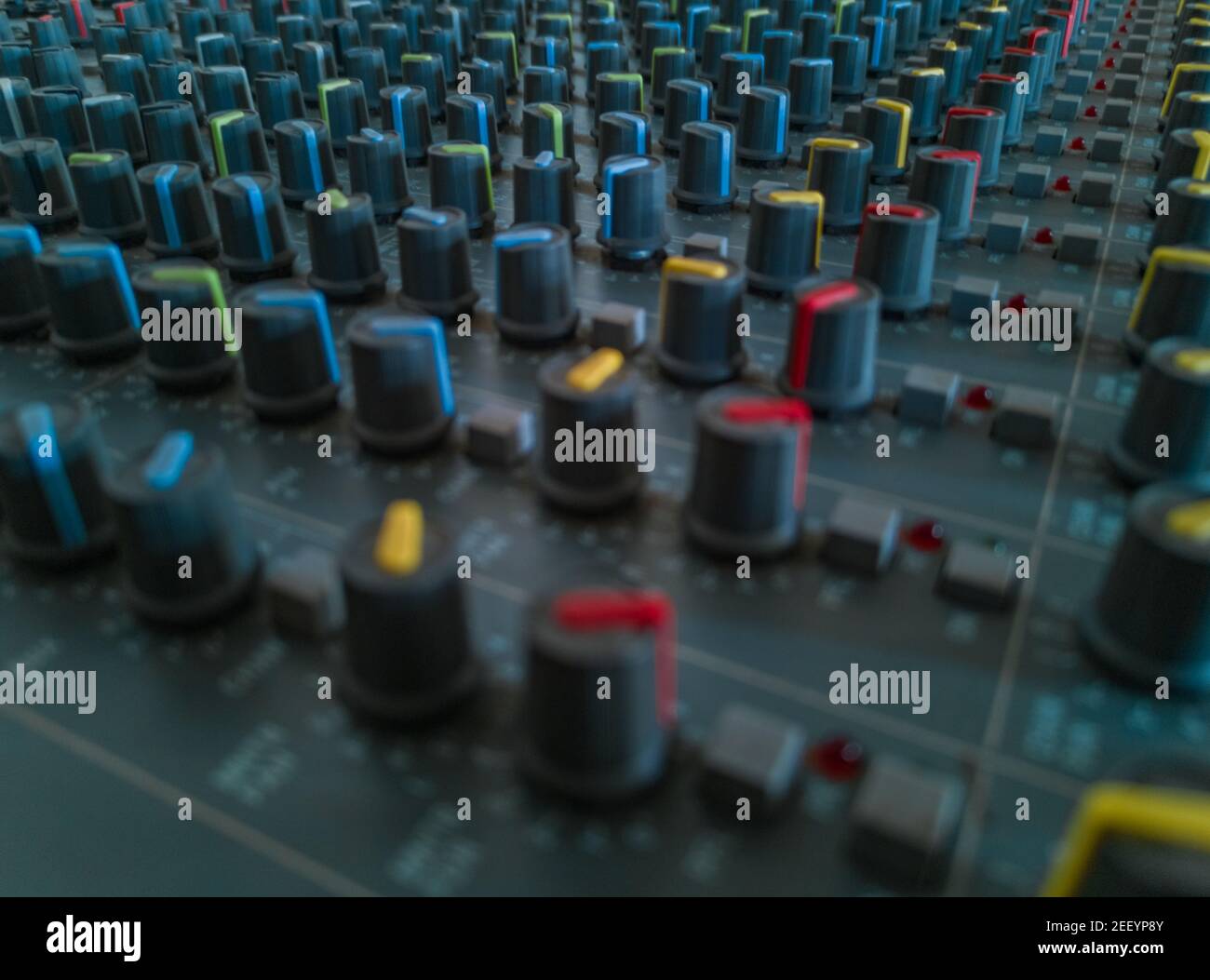 Front panel of old music radio console with colorful potentiometers and ...