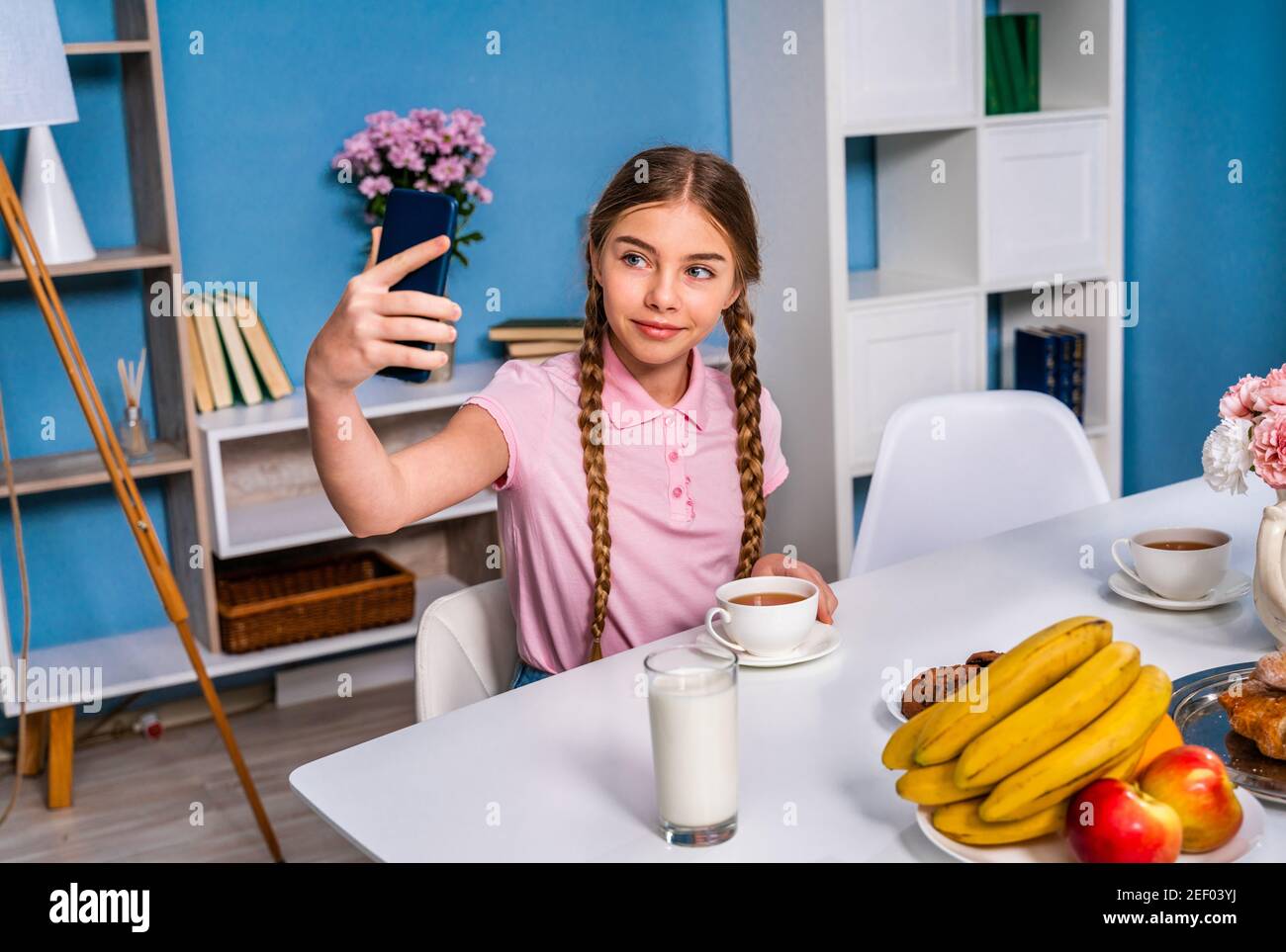 Cute girl doing breakfast in the morning at home - Beautiful young girl ...
