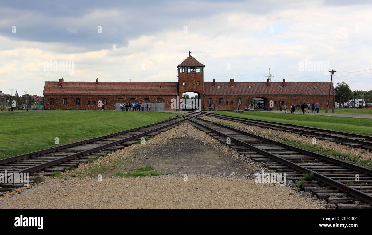 Rail tracks, gate house with guard tower in the background, of ...