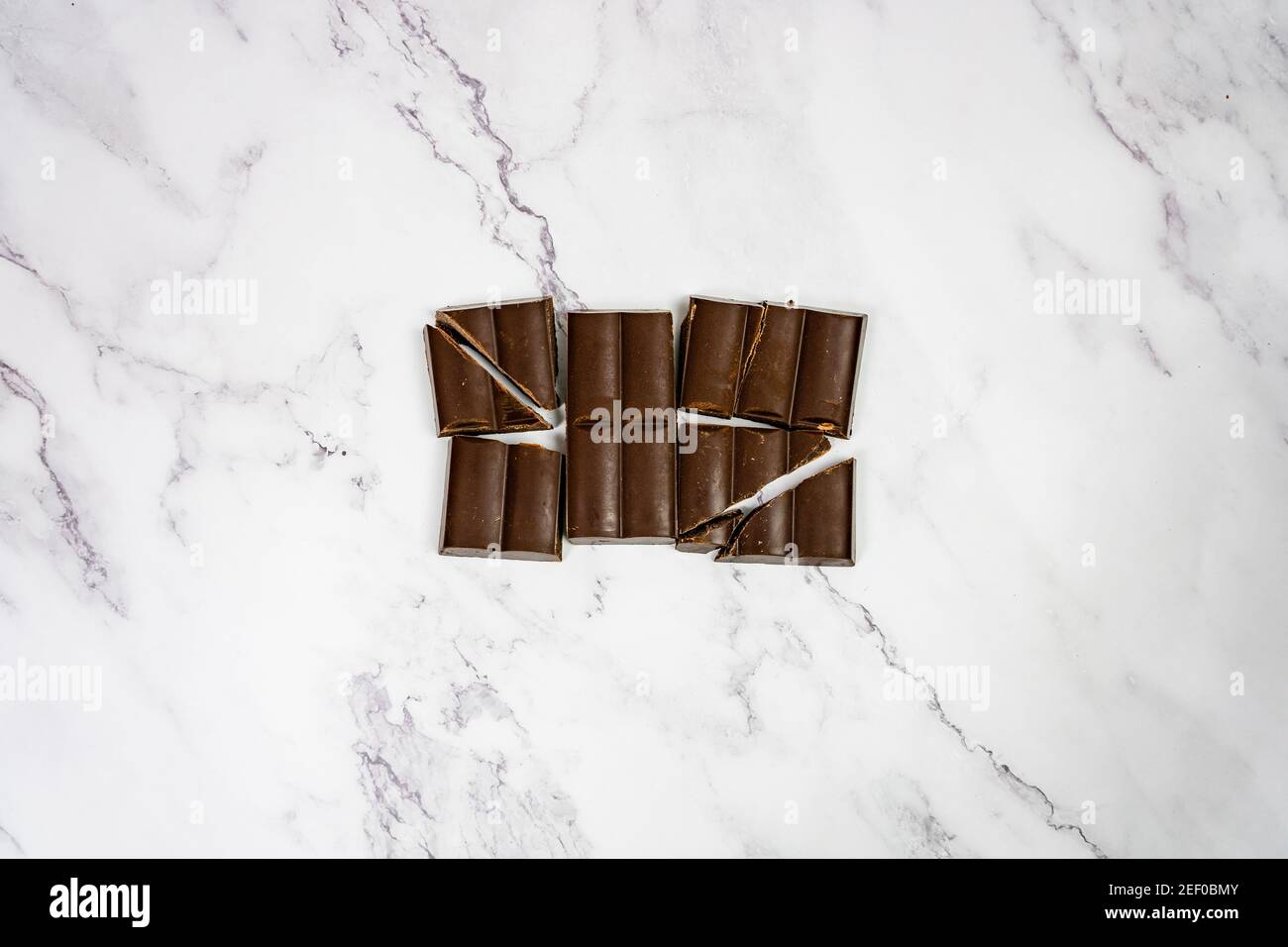 quality chocolate on white marble background tablet into pieces Stock ...