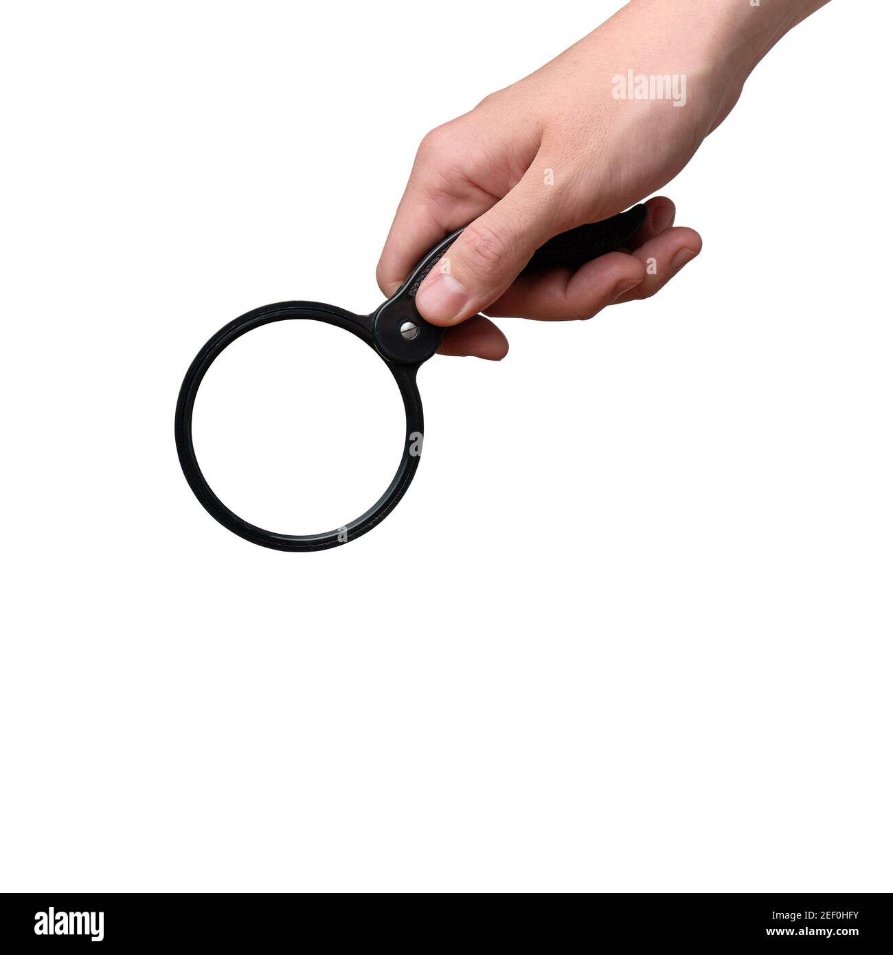 Hand holding a magnifying glass isolated. Close up Stock Photo - Alamy