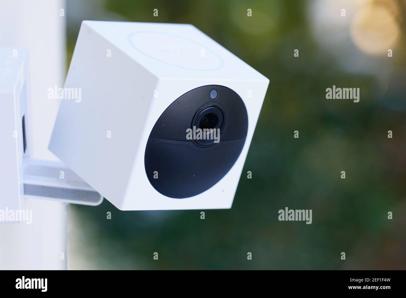 A house security camera mounted by a front door Stock Photo - Alamy