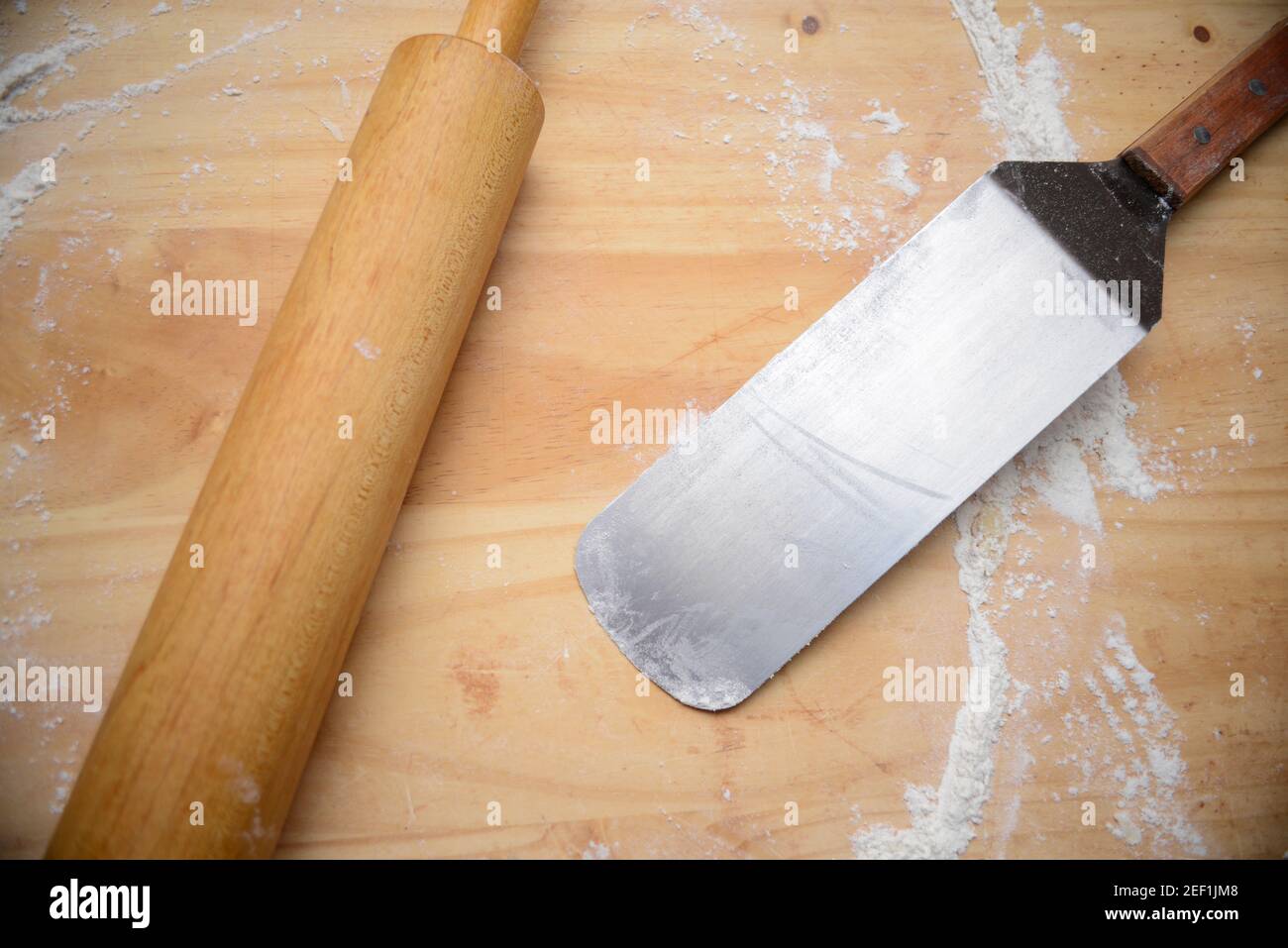 Cutting board coated in flour for baking preparation Stock Photo - Alamy