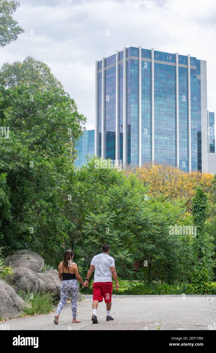 RIO DE JANEIRO, BRAZIL - JANUARY 2, 2020: A couple take a walk holding ...