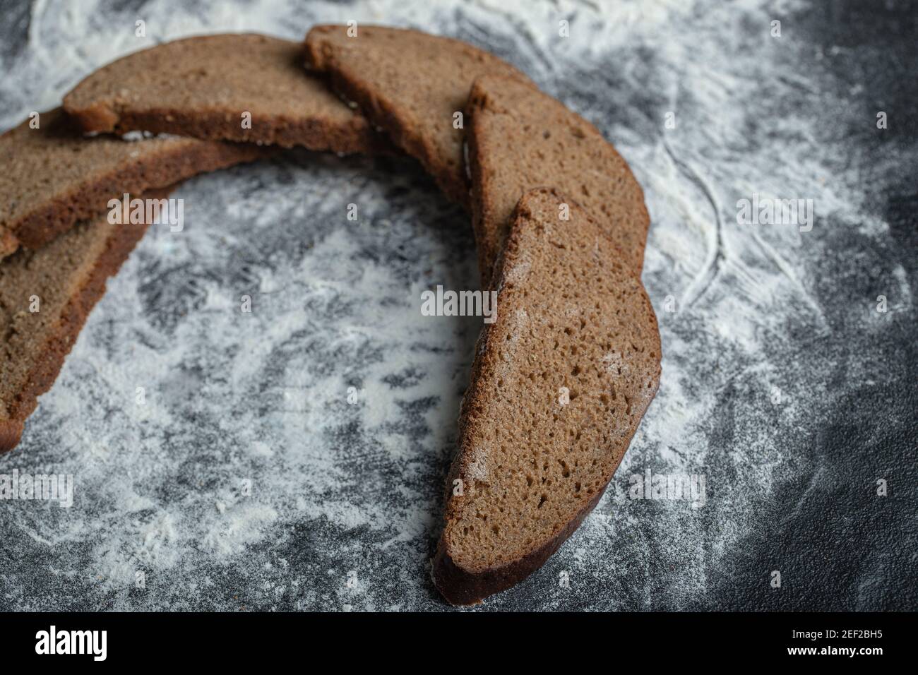 Stack of sliced breads on flour background Stock Photo - Alamy