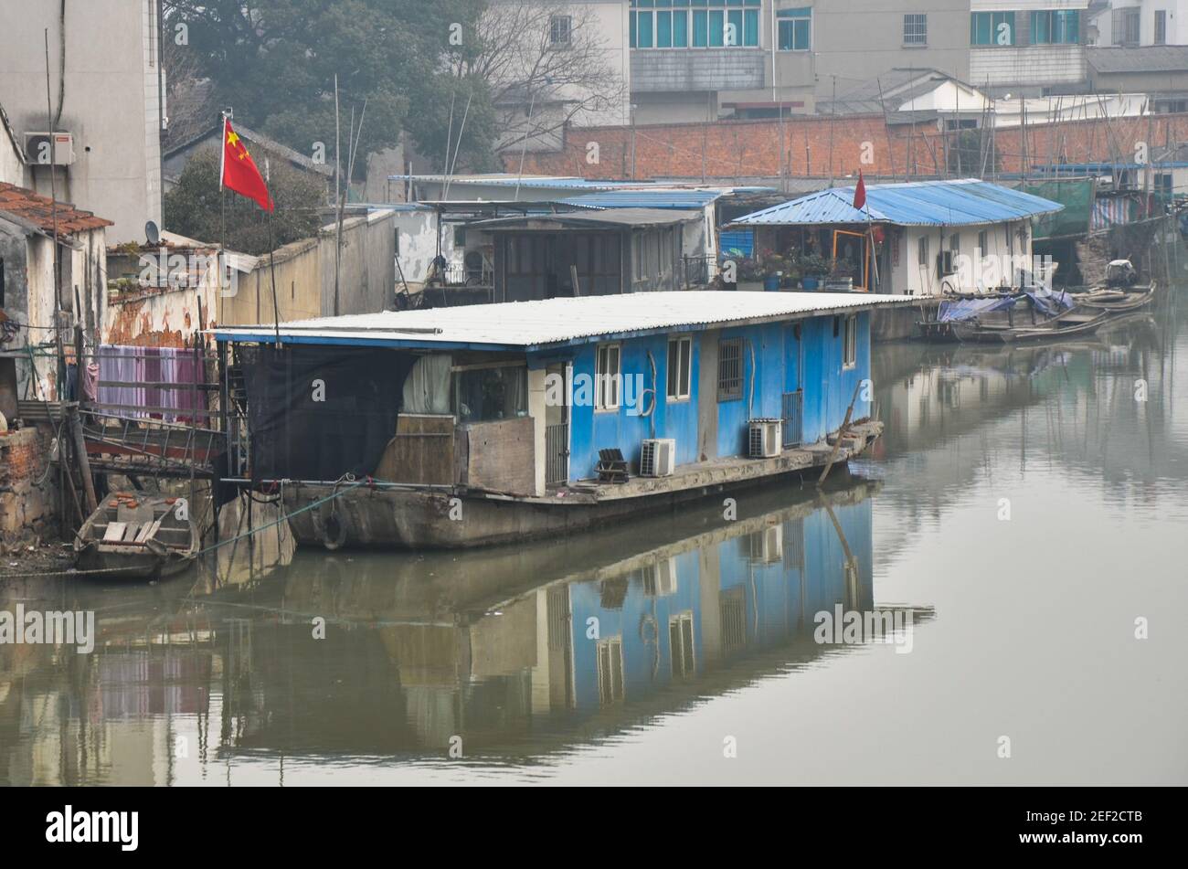 Old floating house on a river in Tongli - water town in China Stock ...