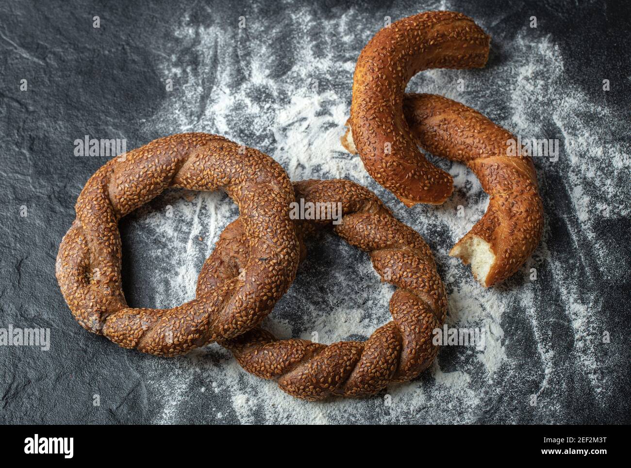 Fresh tasty Turkish simit whole or half cut Stock Photo - Alamy