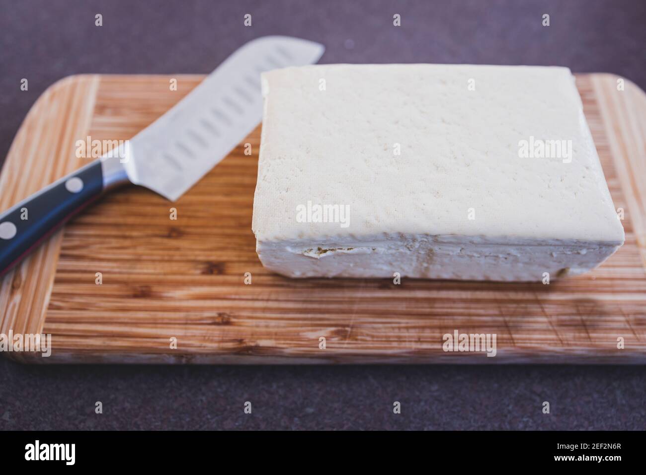 simple food ingredients concept, block of extra firm tofu on cutting ...