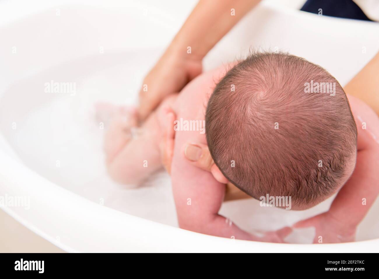 Infant bathing hi-res stock photography and images - Alamy
