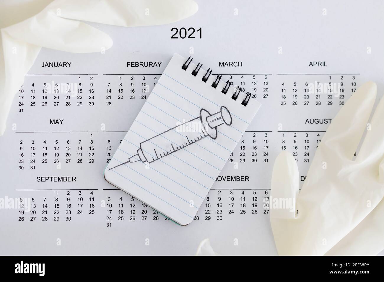 covid-19 vaccine against the pandemic, 2021 calendar with syringe ...
