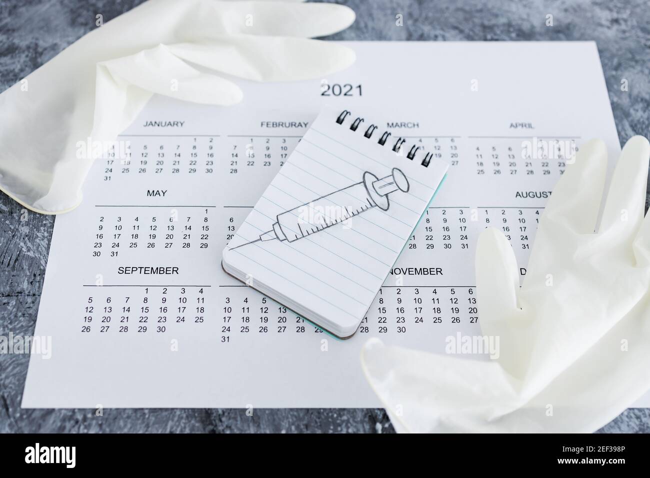 covid-19 vaccine against the pandemic, 2021 calendar with syringe ...