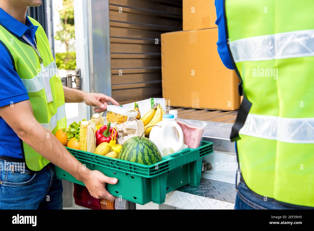 Delivery man checking food before taking out from the car about to ...