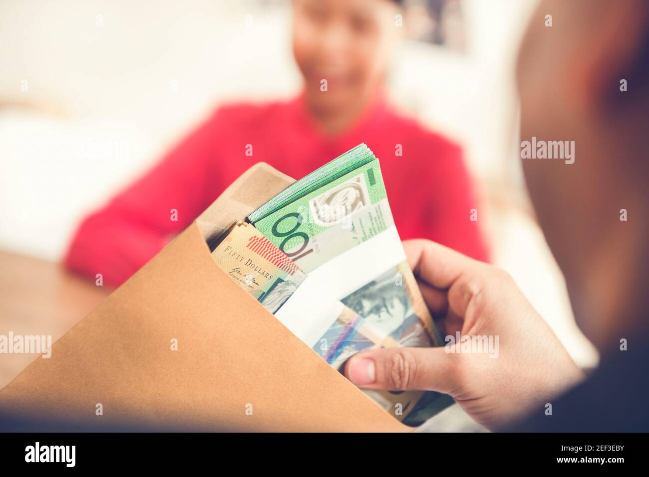 Businessman checking money, Australian dollars, in the envelope Stock ...