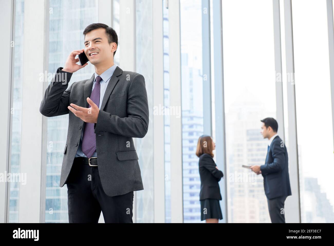 Attractive man using cell telephone hi-res stock photography and images ...