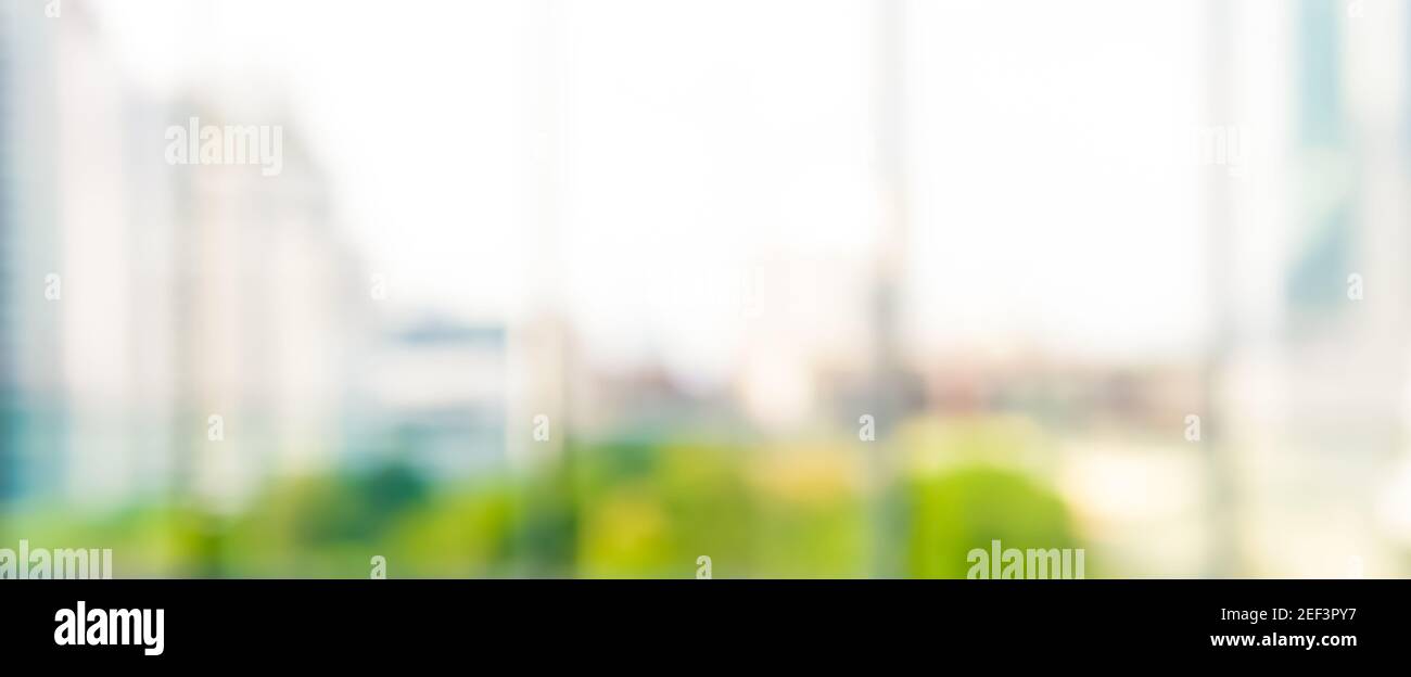 Blur city building view looking through glass window, abstract ...