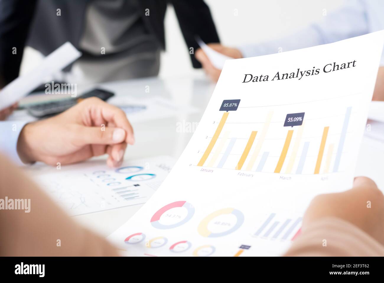 Business people discussing and analyzing graph data at the meeting ... Business people discussing and analyzing graph data at the meeting ...