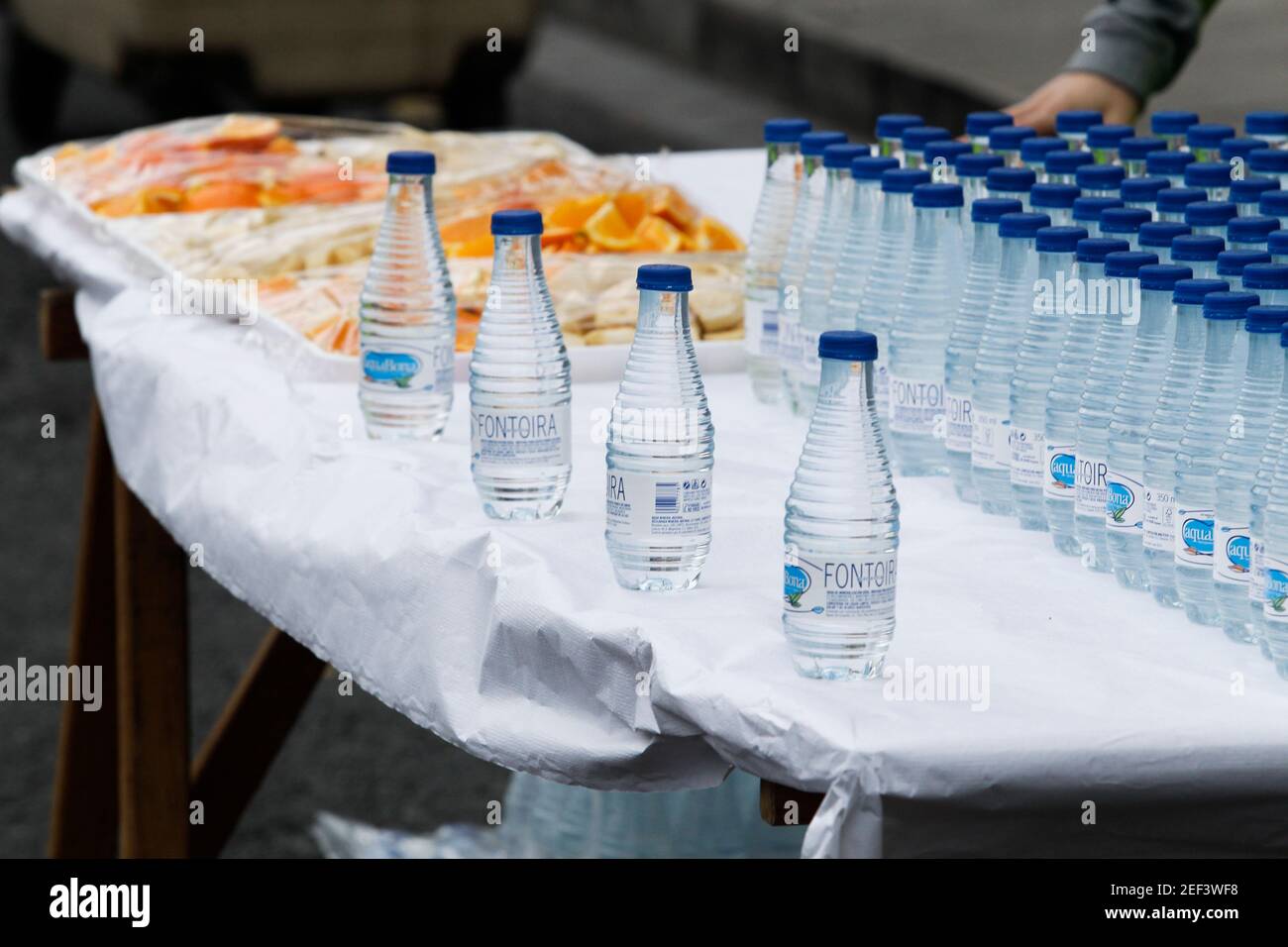 A Coruna-Spain. Liquid refreshment table in popular marathon on ...