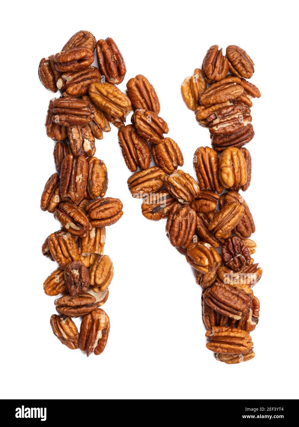 Letter N of the English alphabet from pecans on a white isolated ...