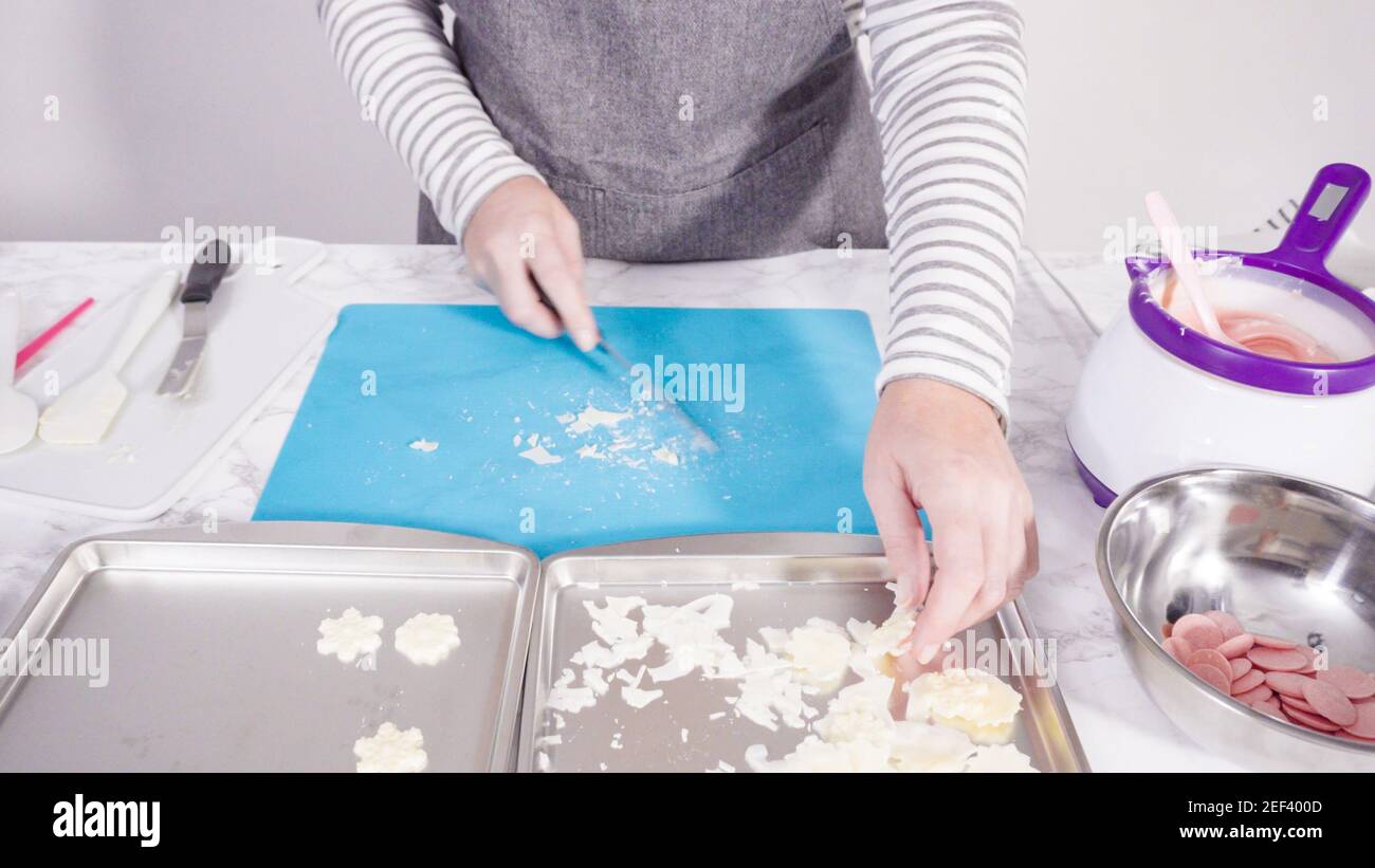 Step by step. Trimming excess chocolate with a small kitchen knife from ...