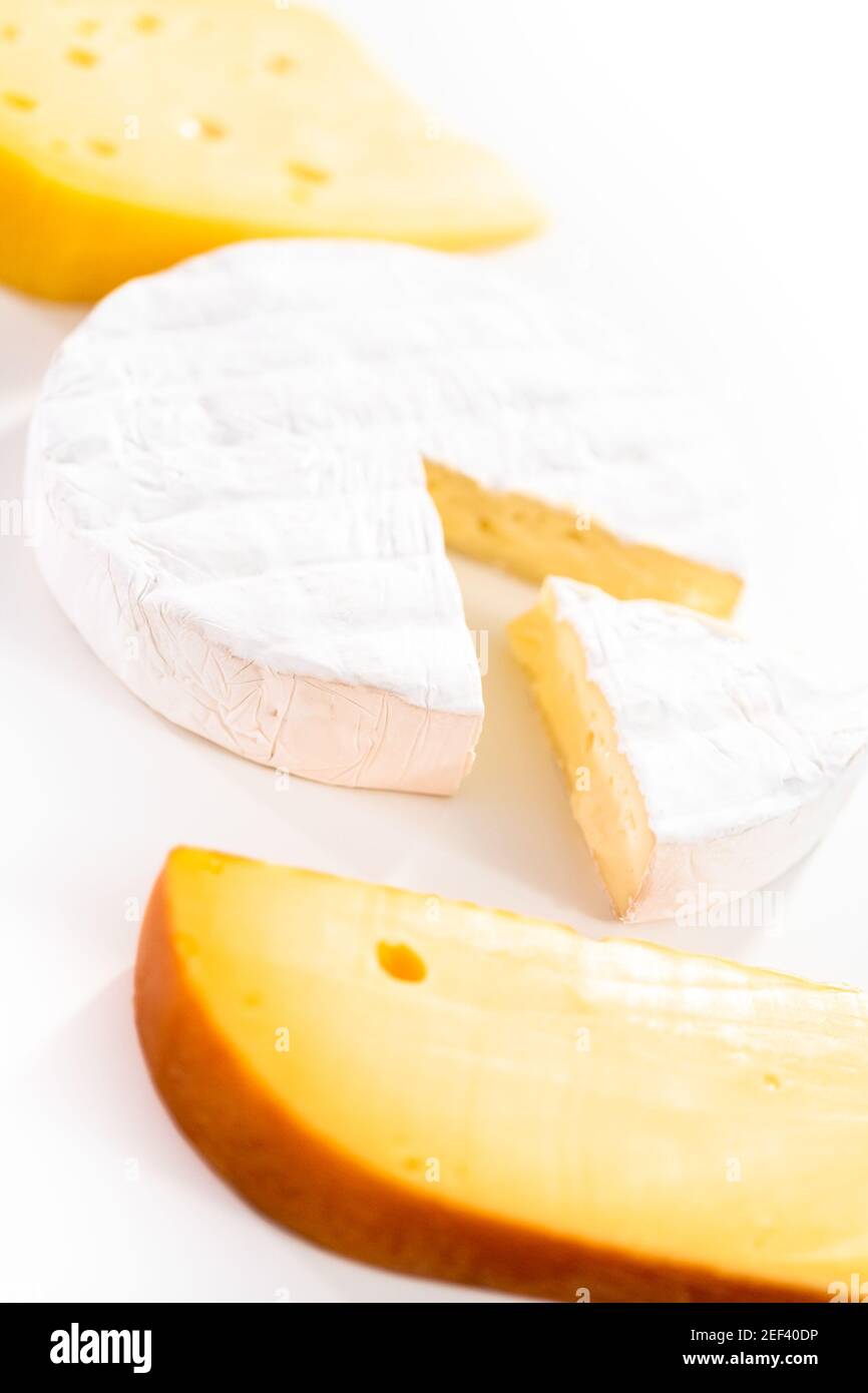 Variety of large wedges gourmet cheese on a white background Stock ...