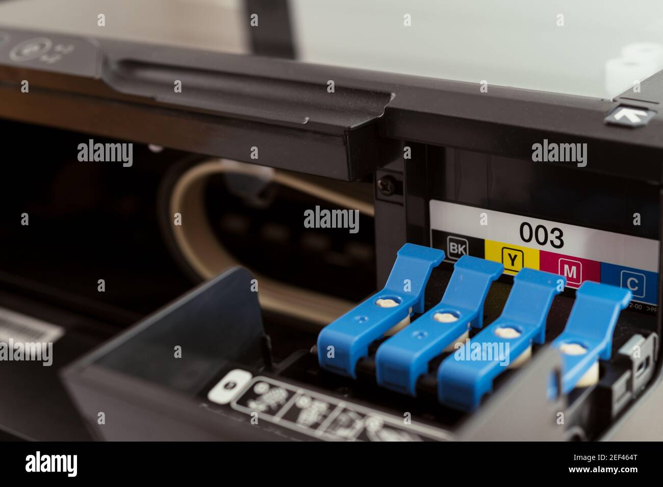 Replacement of CMYK set of ink cartridges in printer Stock Photo - Alamy