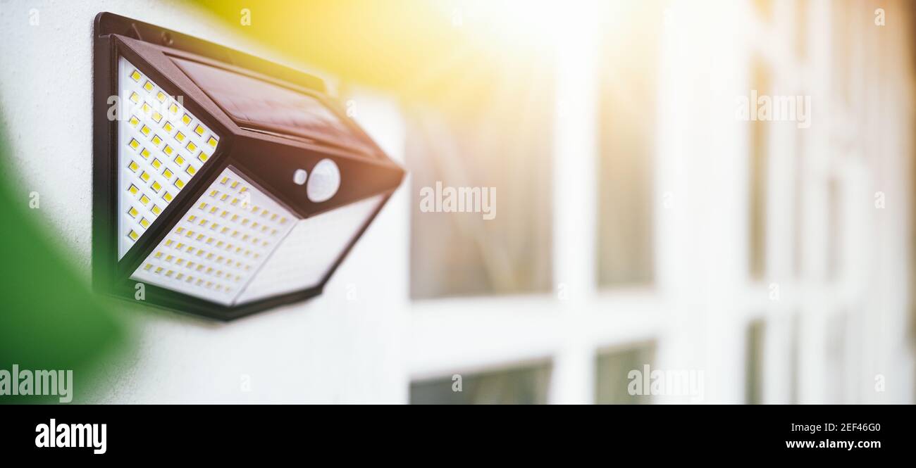 Small solar powered led light with motion sensor Stock Photo - Alamy