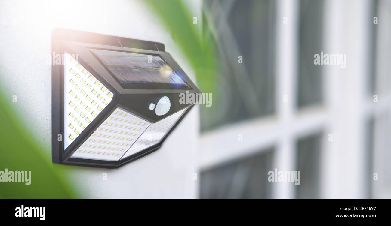 Small solar powered led light with sun light Stock Photo - Alamy