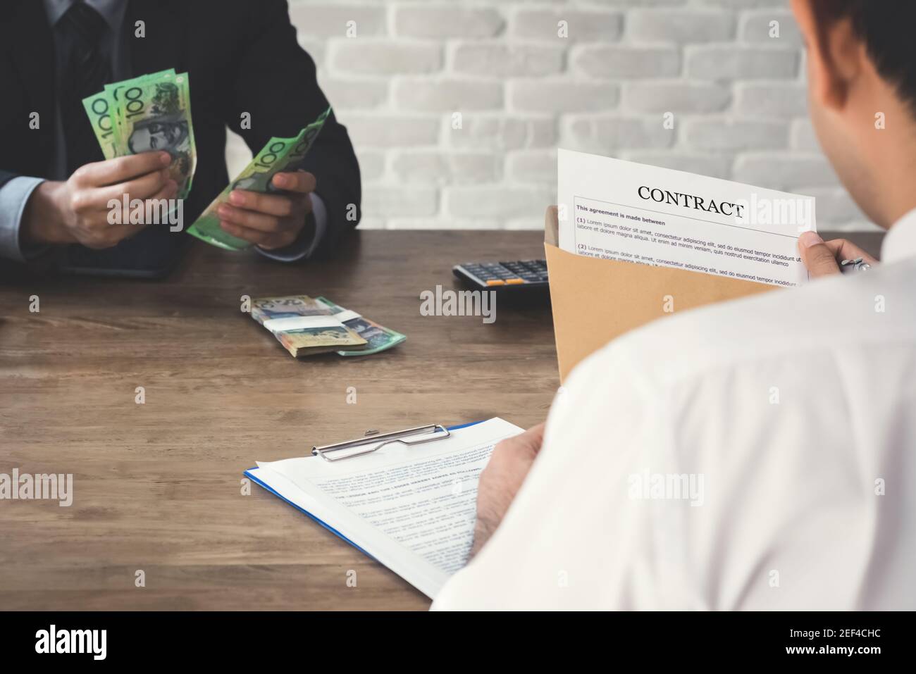 Business partner making a contract - loan, bribery and corruption ...