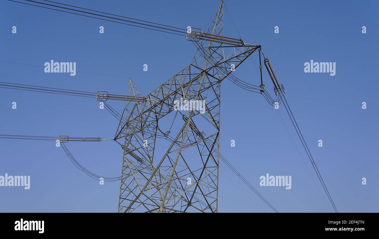 Power energy and technology concept. AC high voltage lines through ...