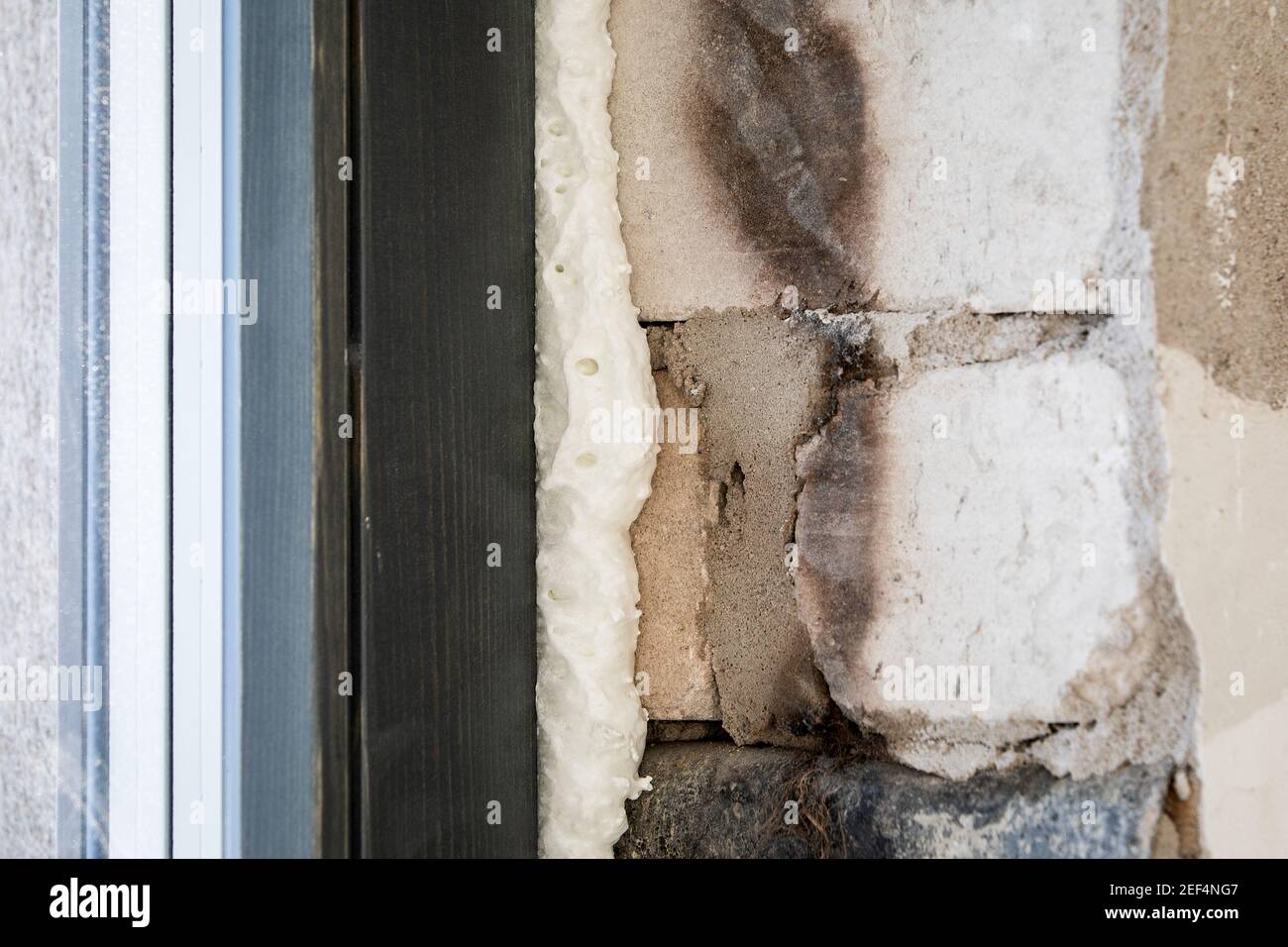 Installation of energy efficient windows. Mounting foam Stock Photo - Alamy