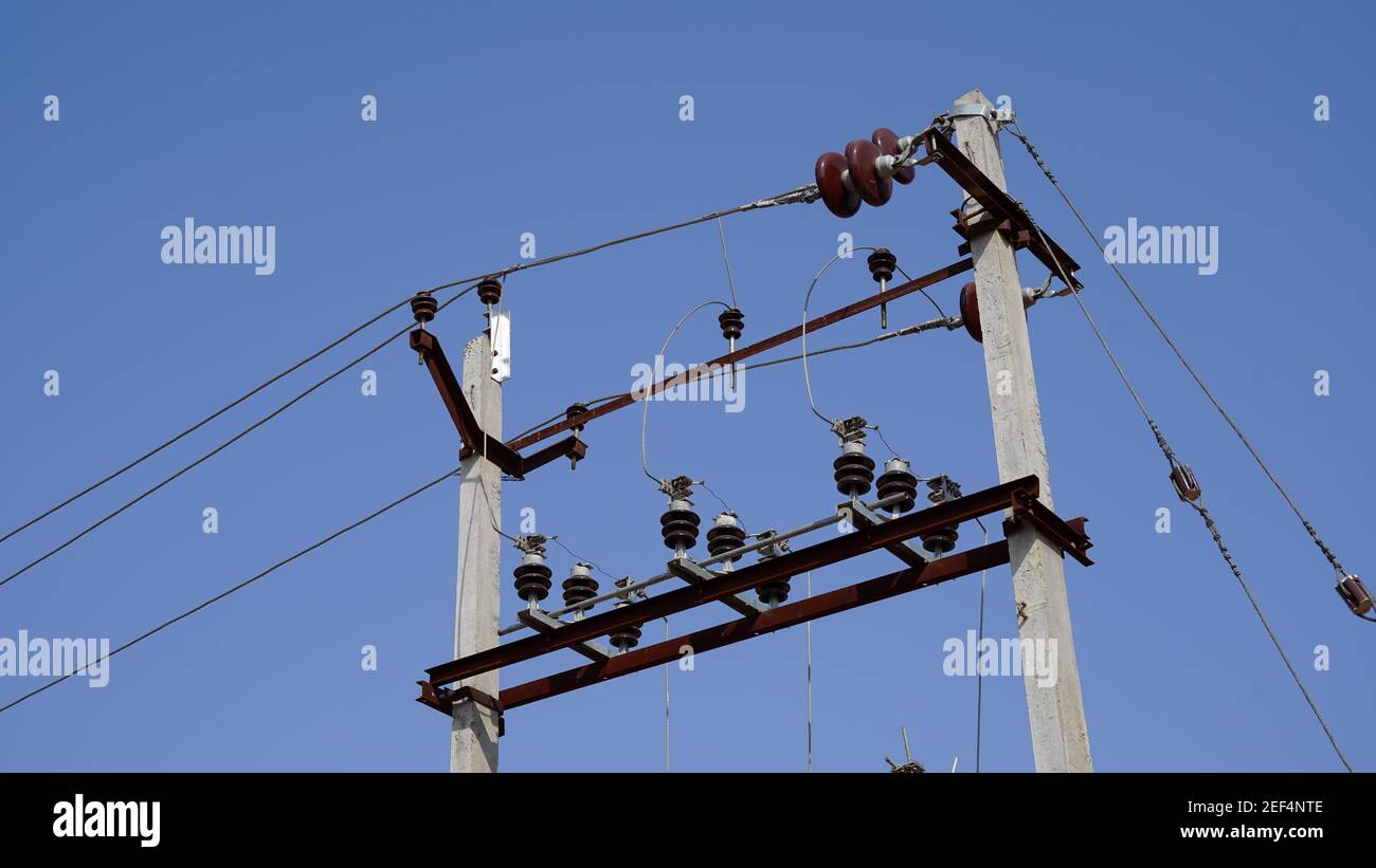 Wire trap and insulator on cement poles. Power supply lines on the ...