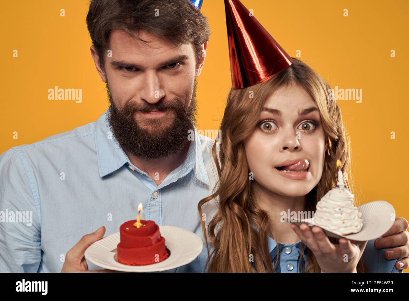 Birthday party man and woman fun yellow background cap holiday Stock ...