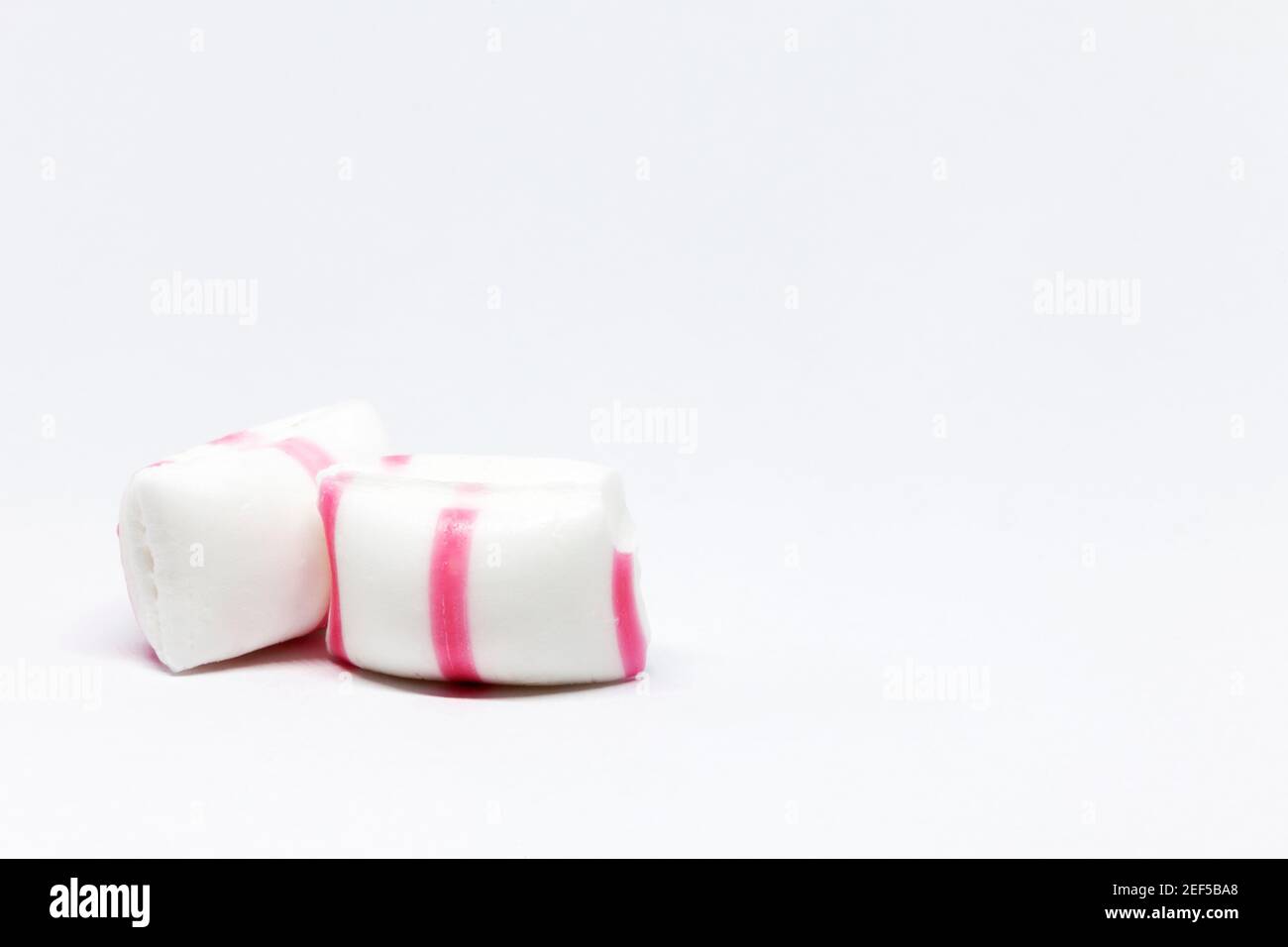 two little polka dots on white background Stock Photo - Alamy