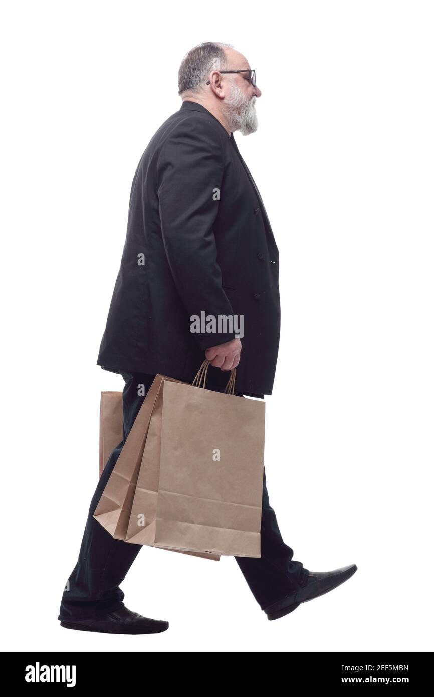 confident business man with shopping bags striding forward Stock Photo ...