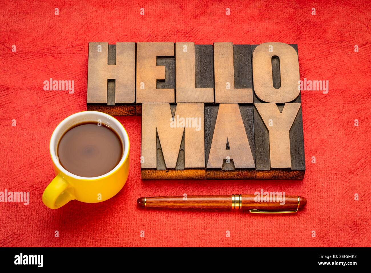 Hello May word abstract in vintage letterpress wood type with a cup of ...