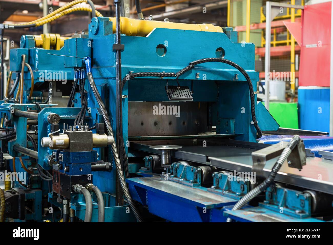 Roller forming machine. The interior of the plant producing a metal ...