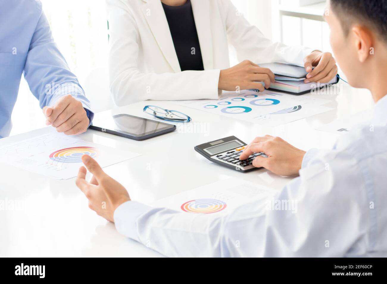 Business people discussing financial document at the meeting Stock ...