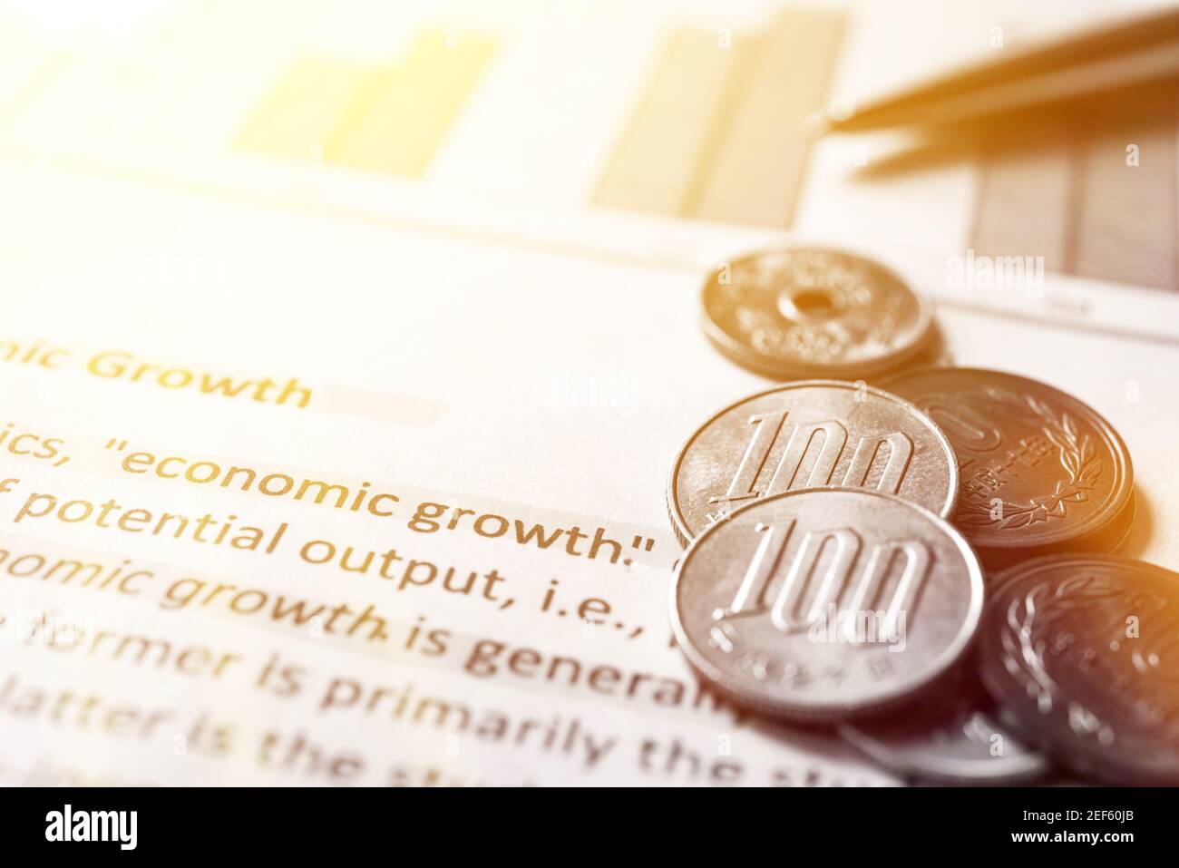 Money, Japanese yen coins, on economic report sheet Stock Photo - Alamy