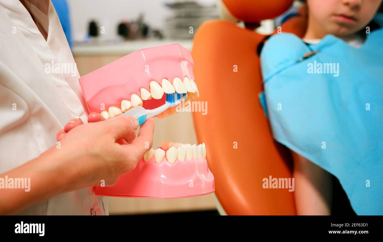 Nurse helping patient brushing teeth hi-res stock photography and ...