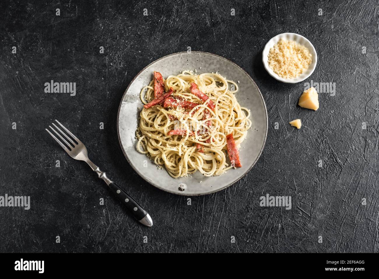 Carbonara pasta, spaghetti with bacon, egg, hard parmesan cheese and ...
